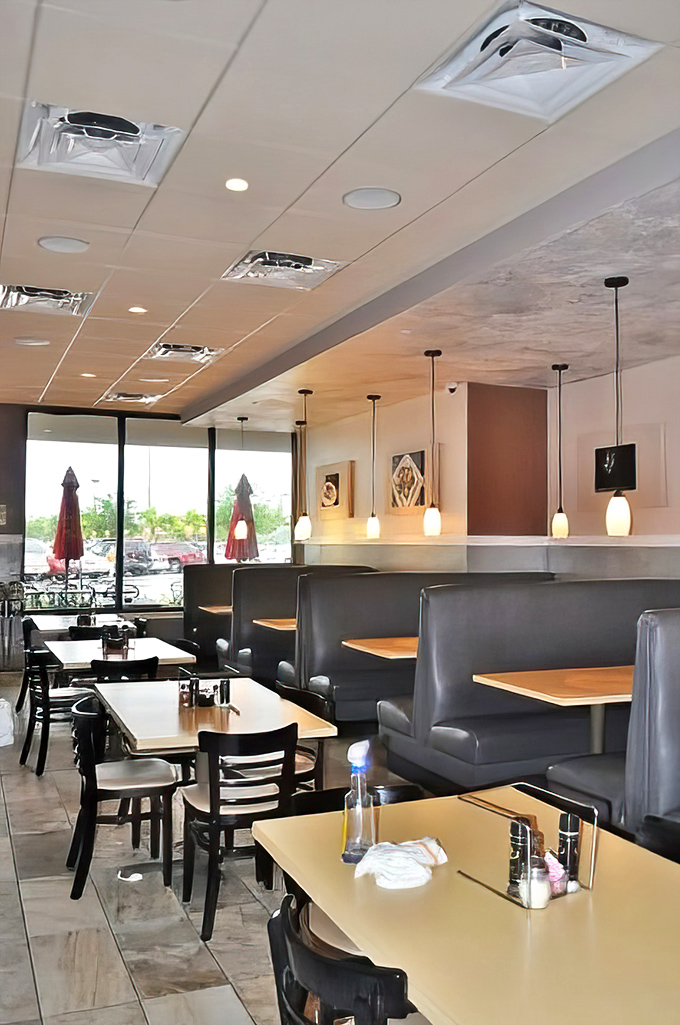 Inside, it's all business – comfortable booths, practical tables, and pendant lighting that says, "We care about ambiance, but we care about your pizza more."