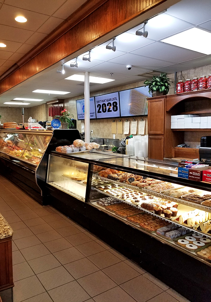 Behind the counter, decades of deli tradition come alive. Those display cases aren't just storing food—they're preserving cultural heritage one cookie at a time.