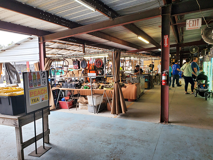 Bargain hunters navigate the covered marketplace, where overhead fans keep the Florida heat at bay while shoppers hunt for deals.