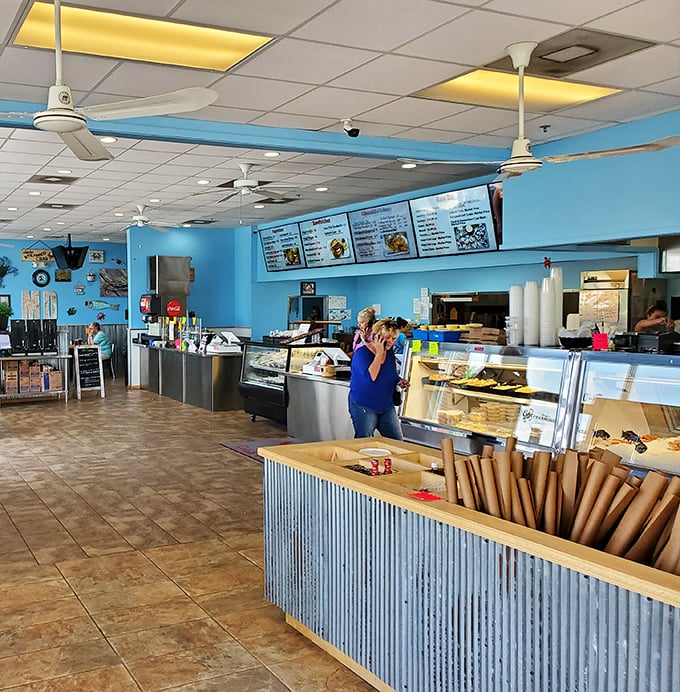 The bright blue walls and casual setup scream "roll up your sleeves" – this is serious crab business.