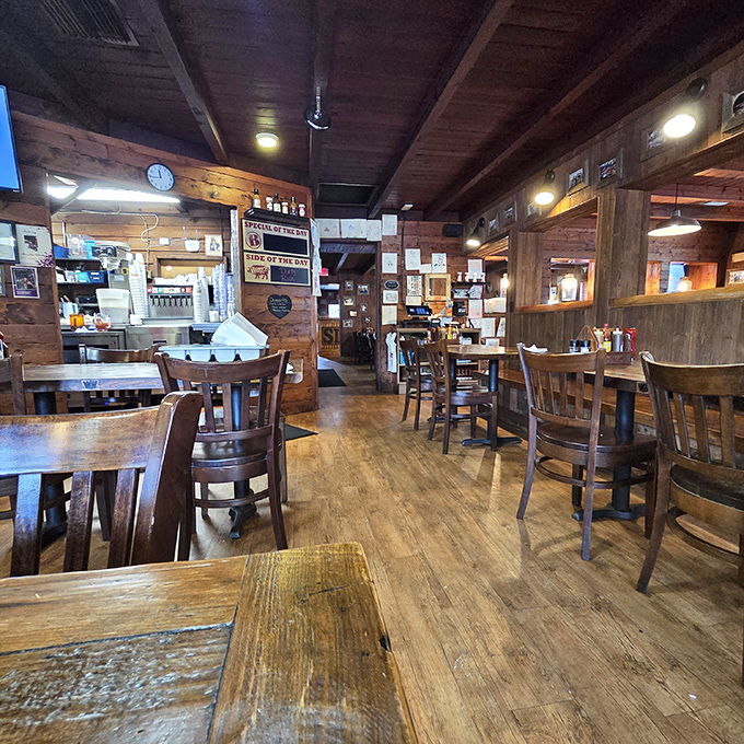 Step inside and the rustic wooden interior whispers promises of comfort food that'll make you want to unbutton your pants before you even order.