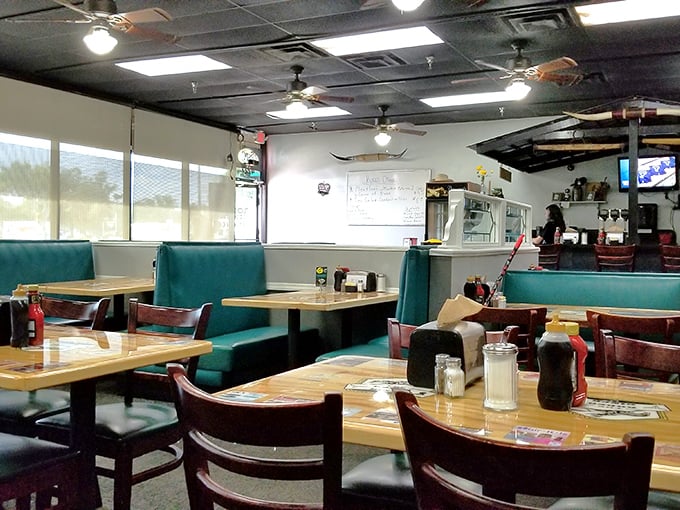 Teal vinyl booths and wooden tables create that perfect diner atmosphere where conversations flow as freely as the coffee.