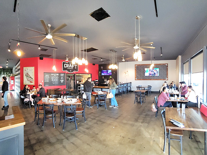Bright red walls and modern lighting create an atmosphere where comfort meets cool—like your favorite jeans paired with a new jacket.