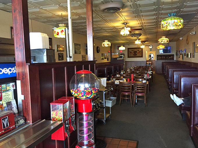 Step inside and time slows down. Those Tiffany-style lamps cast a warm glow over wooden booths that have witnessed countless first dates, family celebrations, and late-night college cram sessions.