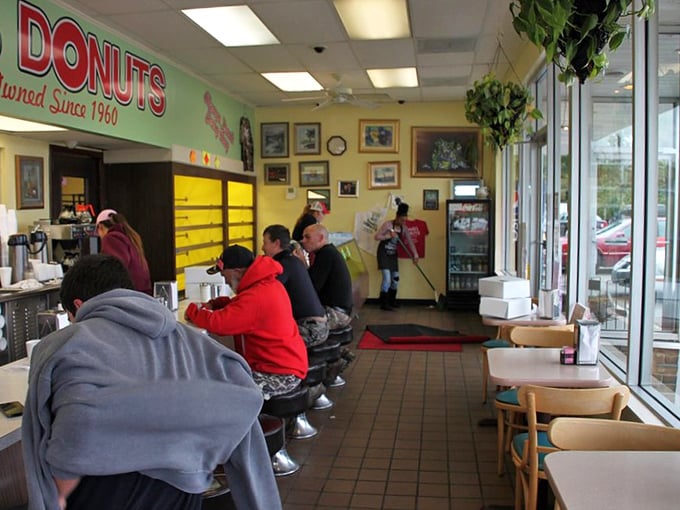 Morning regulars line the counter like faithful parishioners at the altar of fried dough, participating in Zanesville's most delicious daily ritual.