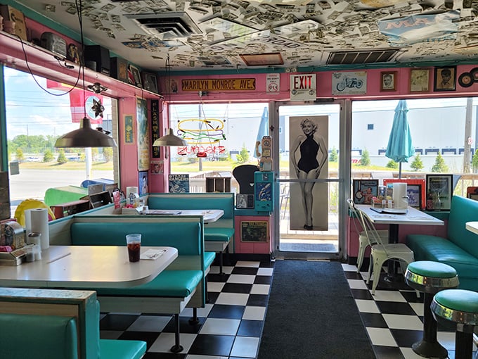 Step inside and the 1950s grab you by the appetite—turquoise booths, checkered floors, and enough memorabilia to make the Smithsonian consider a hostile takeover.