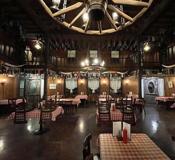 Wagon wheel chandeliers and hundreds of dangling neckties create an atmosphere that whispers, "Loosen your collar, partner—you're in for a treat."