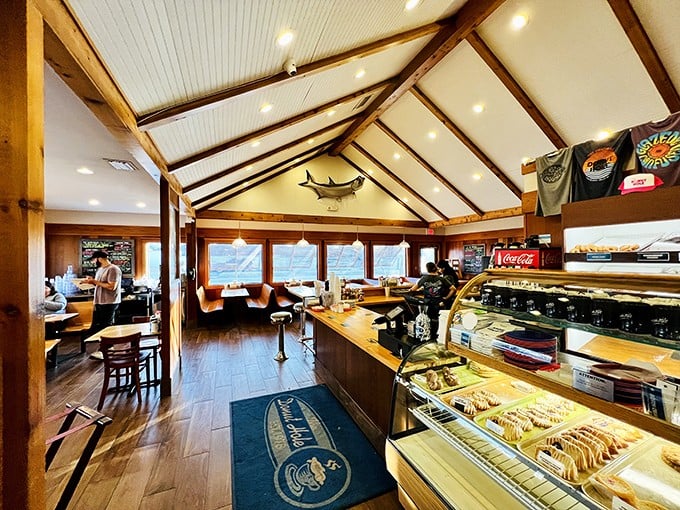 Wooden beams, nautical touches, and the aroma of fresh pastries—this interior feels like the living room of that cool beach house you wish you owned.