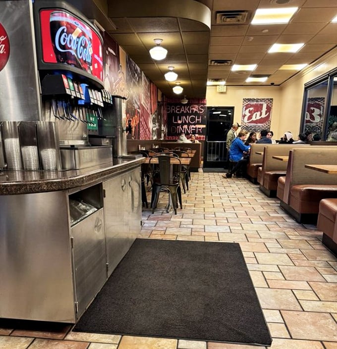 Where tile floors meet comfort food dreams. The soda fountain whispers promises of fizzy delights to accompany your burger adventure.