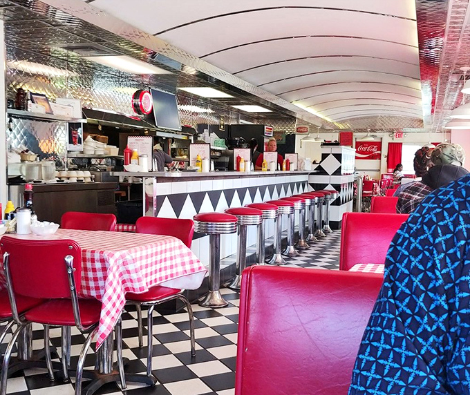Step inside and you're transported to a bygone era – red vinyl booths, checkerboard floors, and chrome accents create the quintessential American diner experience that no corporate chain could replicate.