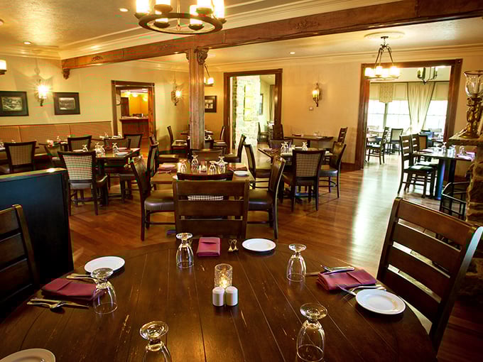 Warm wooden beams frame a dining room where memories are made. This isn't just dinner—it's theater in the round with steak as the star performer.