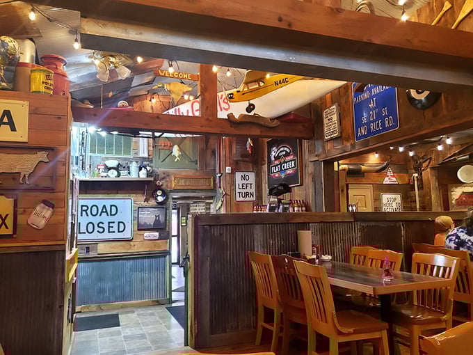 Americana overload! Every inch of wall space tells a story, from vintage road signs to model airplanes. It's like breakfast inside a delightful time capsule.