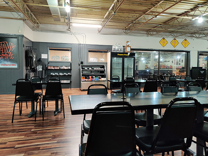 Simple tables, wood-paneled walls, and an open ceiling—this no-frills dining room lets you know immediately that all the attention here goes where it matters: the smoker.