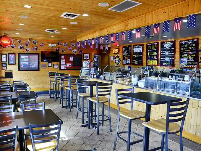 Knotty pine walls and American flags create the perfect backdrop for barbecue contemplation. This isn't fine dining—it's something better: honest food in an unpretentious setting.