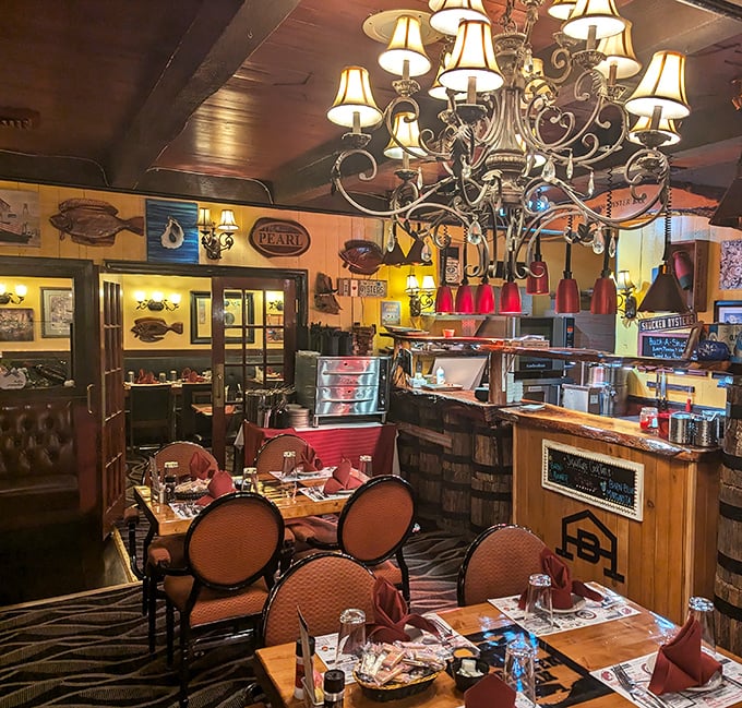 Step inside and you're transported to steakhouse heaven – dark wood, nautical touches, and chandeliers that say "your diet ends here."