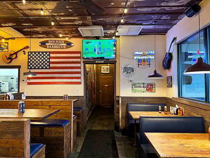 Inside, American flags and wooden booths create that perfect "come as you are" vibe where napkins aren't just suggested—they're mandatory equipment.