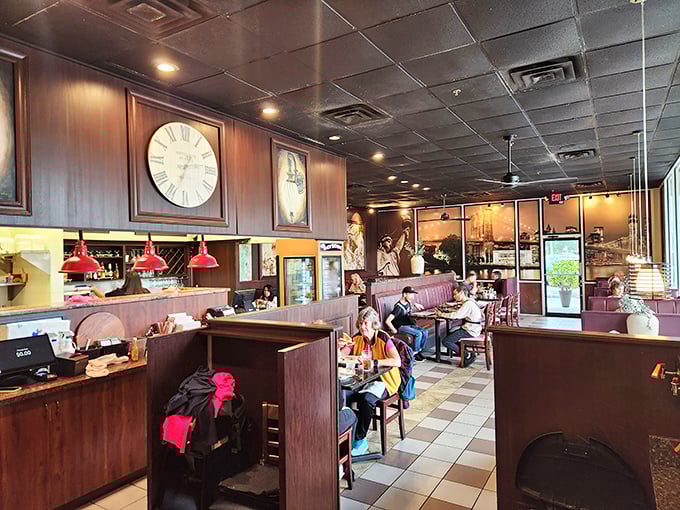 Classic diner ambiance with burgundy booths and checkered floors. Those wall clocks aren't just decoration—they're counting down to your next meal.