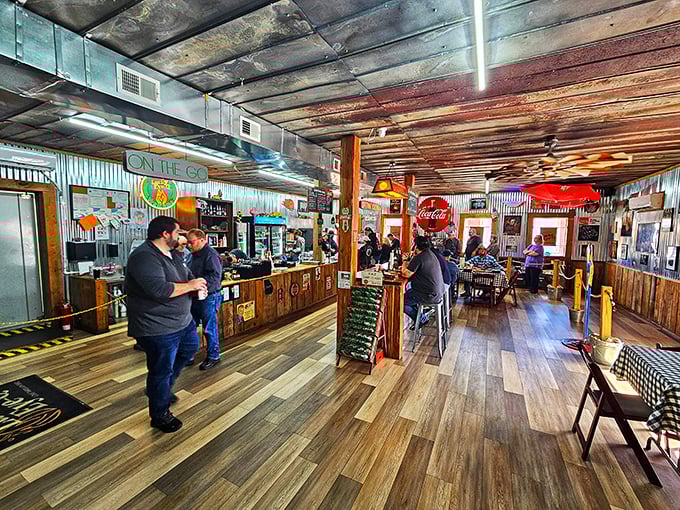 Step inside and the aroma hits you like a welcome hug. Wood paneling, vintage signs, and that unmistakable barbecue perfume – you're home now.