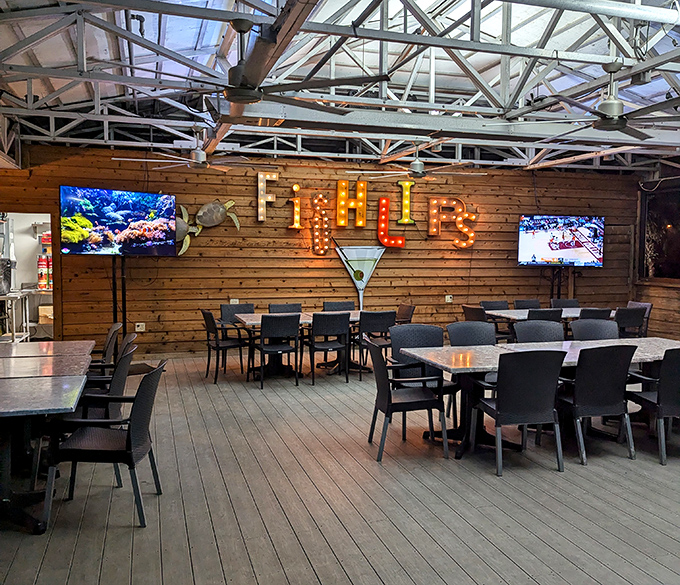 That illuminated sign isn't just decor – it's a beacon calling hungry souls to waterfront dining nirvana.