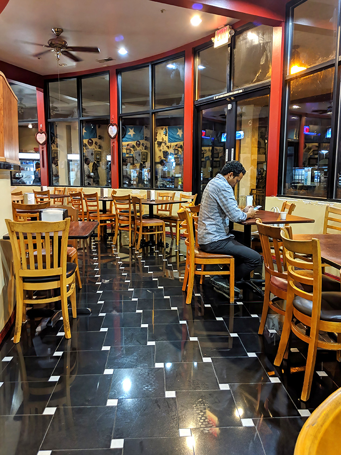 The warm wooden chairs and checkerboard floor create an unpretentious backdrop where the real stars—those magnificent Somali flavors—can truly shine.