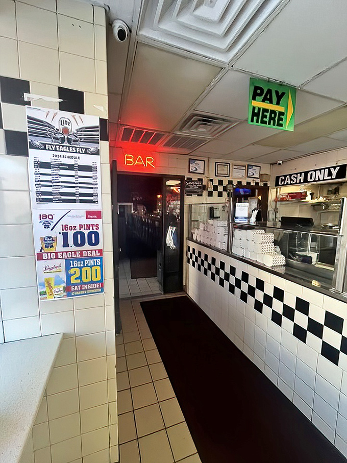 Inside Max's, the checkered counter and "CASH ONLY" sign tell you everything: this place cares about steaks, not trends or credit card points.