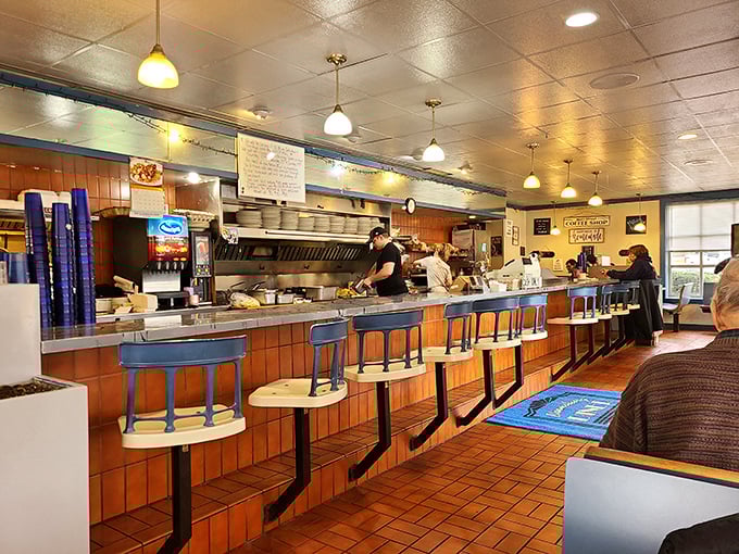 Where breakfast dreams come true – the classic counter seating invites you to witness short-order wizardry up close while the aroma of coffee fills the air.