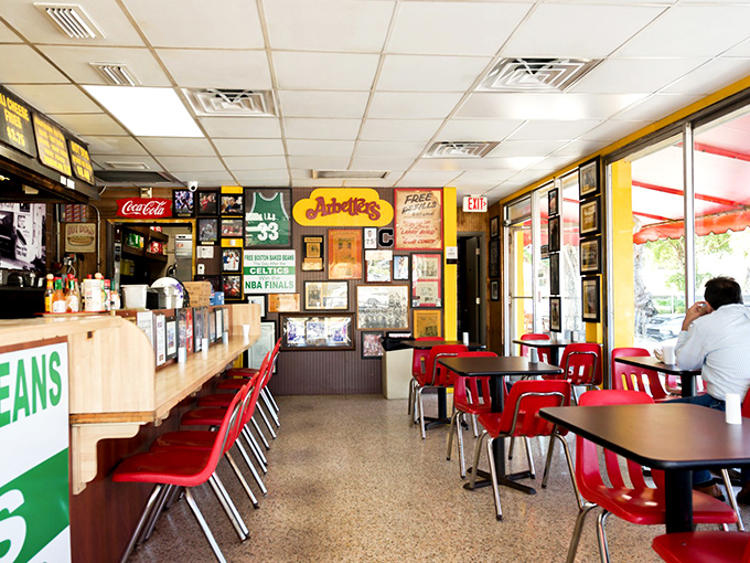 Where memorabilia tells stories and red chairs have witnessed decades of "mmms" and "ahhs." This isn't decoration—it's a museum of Miami memories.