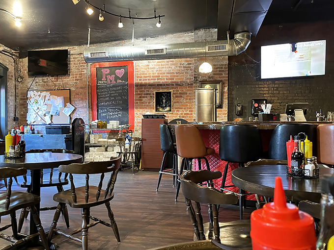 Exposed brick meets modern comfort – like your grandmother's kitchen got a trendy makeover without losing its soul.