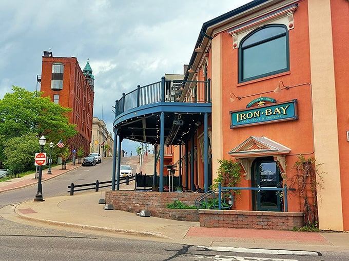 The Iron Bay Restaurant's distinctive blue balcony offers diners front-row seats to Lake Superior's moods—from serene sunrises to dramatic storms.