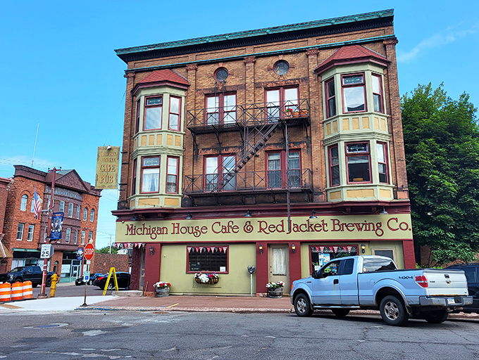 The Michigan House Café & Red Jacket Brewing Co. stands as proudly as your uncle after fixing something that wasn't actually broken. Those bay windows have seen some stories.