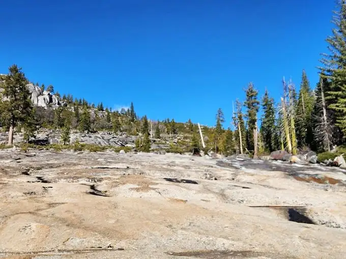 The calm before the plunge. These smooth granite expanses are Mother Nature's version of a water park slide—minus the overpriced admission and questionable snack bar.