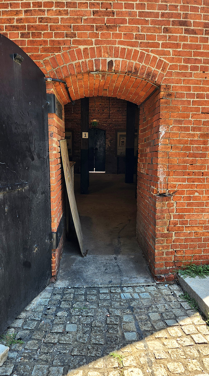 Step through this weathered doorway and travel back two centuries—the entrance beckons with the quiet promise of historical secrets within.
