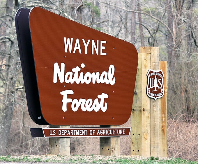 The gateway to adventure doesn't always need neon lights. This humble sign marks the entrance to 244,000 acres of Midwestern magic.