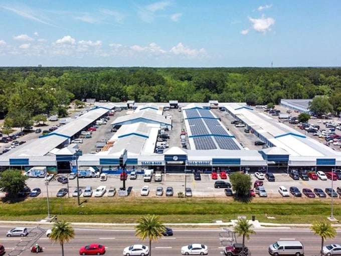 From above, this retail wonderland resembles a small city dedicated to the art of the deal—solar panels included, because even bargain hunting has gone green.