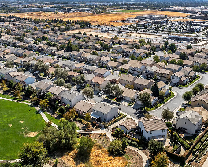 From above, Roseville's thoughtful neighborhood planning reveals itself—actual yards with room for both gardening ambitions and impromptu badminton tournaments.