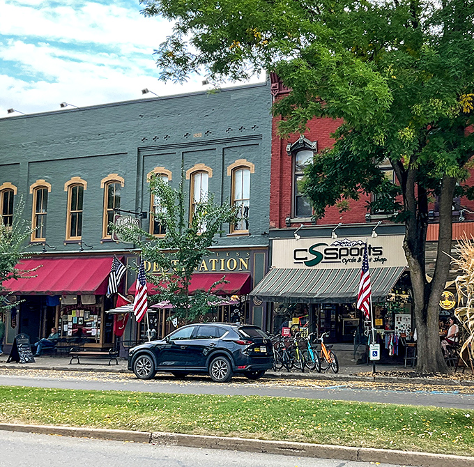Historic storefronts with colorful awnings invite exploration along Wellsboro's downtown, where shopping local isn't trendy—it's tradition dating back generations.