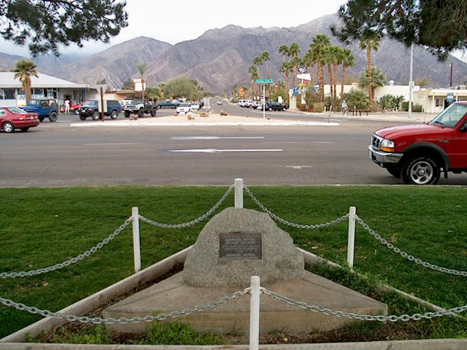 Main Street vibes with mountain majesty as a backdrop. This isn't a movie set – it's everyday life in Desert Hot Springs.