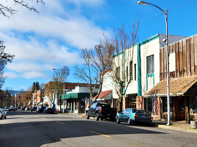 Main Street feels like time travel without the jetlag. Colorful storefronts and American flags create that Norman Rockwell painting you can actually walk through.