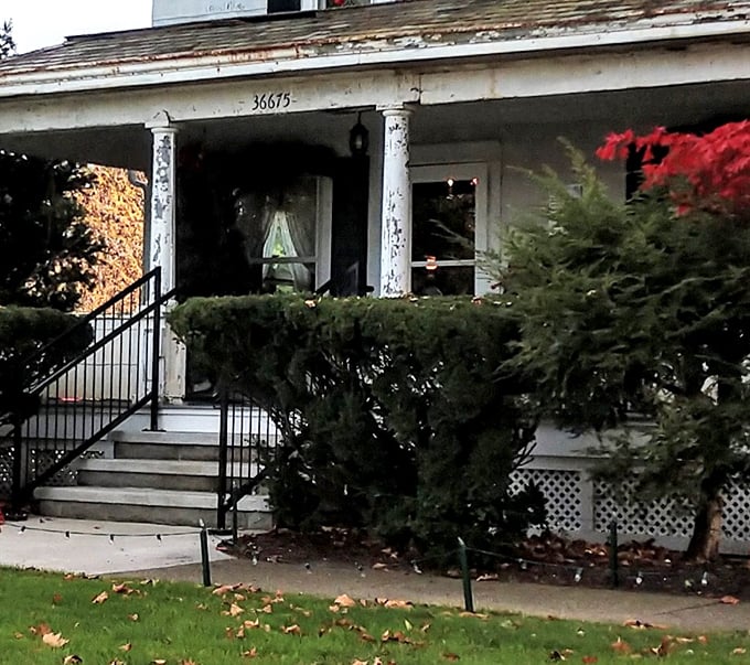 That welcoming front porch isn't just architectural charm—it's the threshold between today's mass-produced world and yesterday's handcrafted treasures.