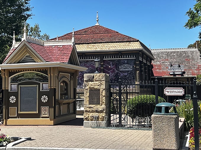 Welcome to wonderland! The charming entrance booth and wrought iron gate serve as portals to one of America's most delightfully perplexing homes.