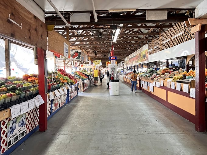 Fresh produce lines both sides of this bustling corridor, where the vibrant colors of nature create a feast for the eyes before becoming dinner.