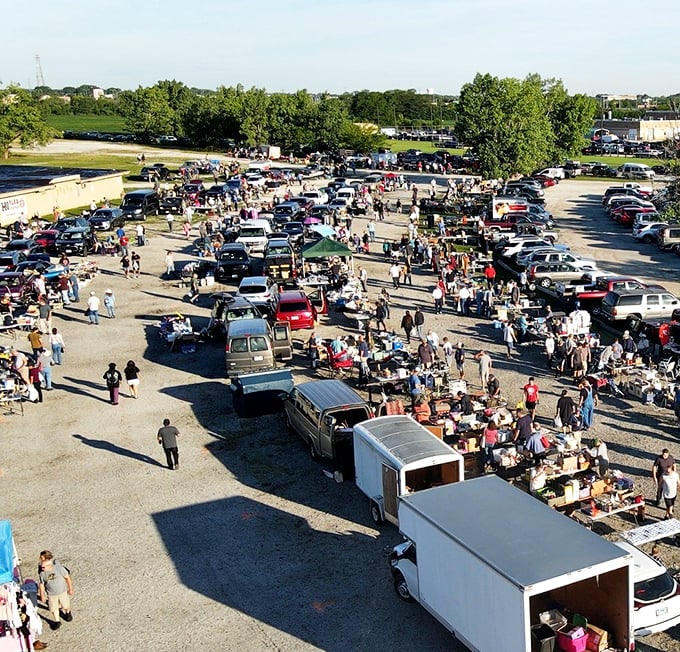 The aerial view reveals the true scale of this bargain hunter's paradise, where hundreds gather in a ritual as old as commerce itself.