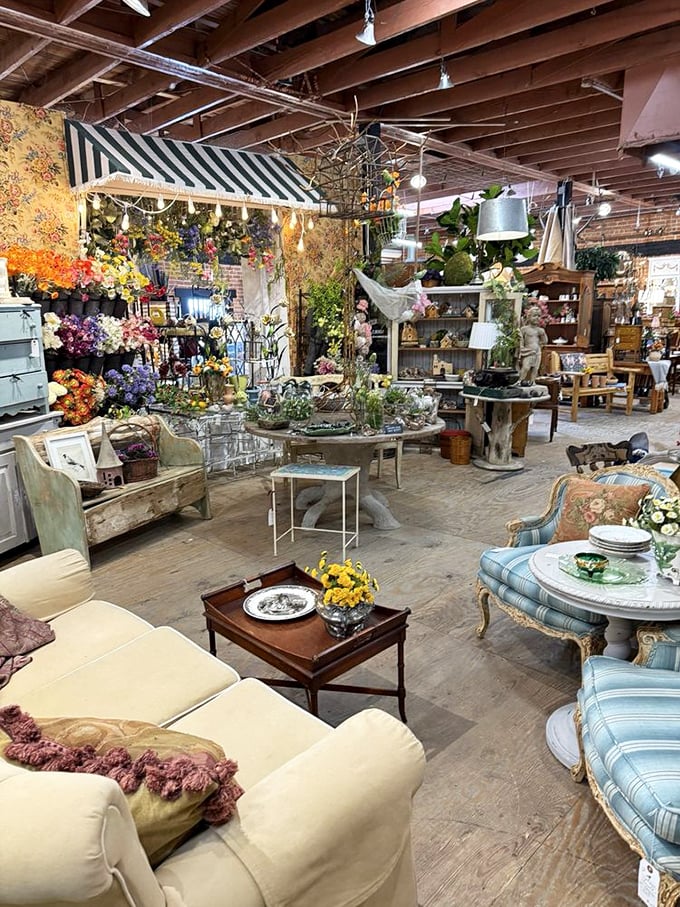 Staged vignettes create little worlds within worlds—this floral-meets-furniture arrangement invites you to imagine hosting tea parties in your own garden oasis.