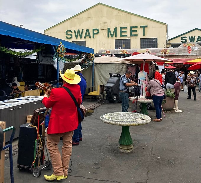 Where bargain hunters and culture seekers converge under a patchwork of colorful umbrellas—retail therapy with a side of authenticity.