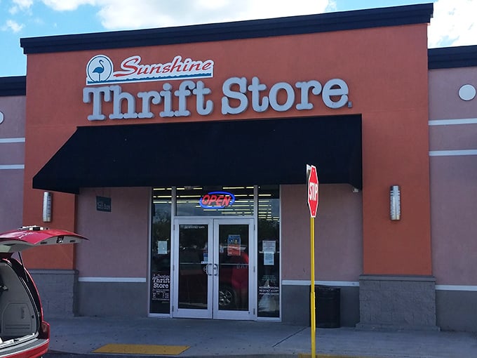 "Your 1st Class 2nd hand store" isn't just a slogan—it's a promise. The neon "OPEN" sign might as well say "Opportunity knocks."