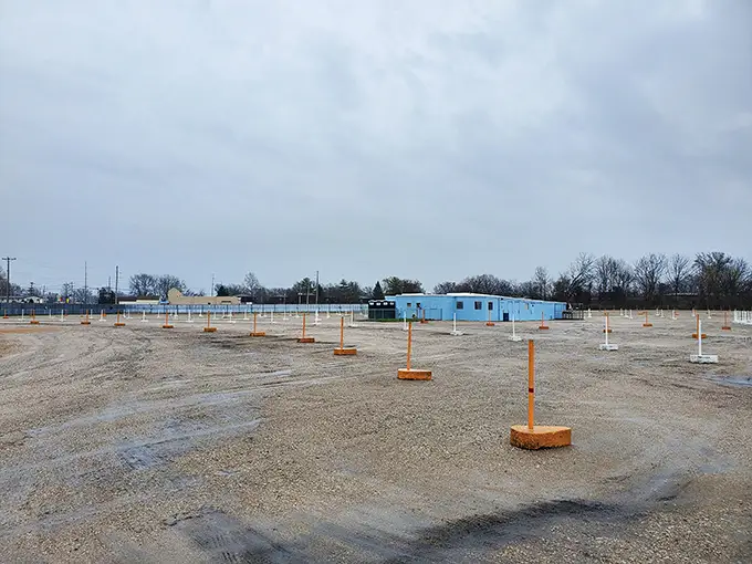 The off-season reveals the bones of this beloved institution. Even empty, there's something poetic about a drive-in waiting for summer's return.
