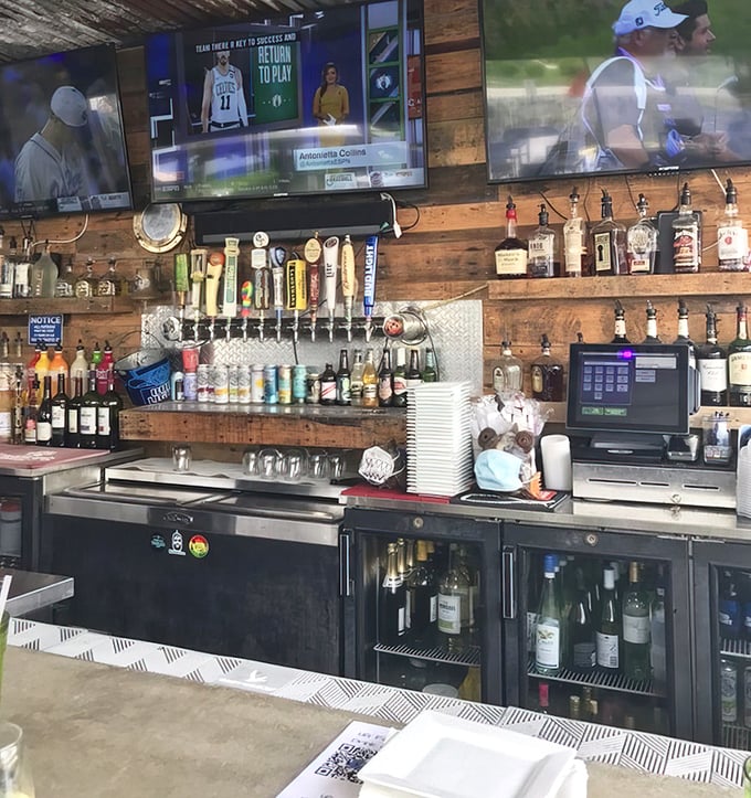 Behind the bar, an impressive array of spirits stands ready while sports play on overhead screens—the perfect backdrop for swapping fish tales.