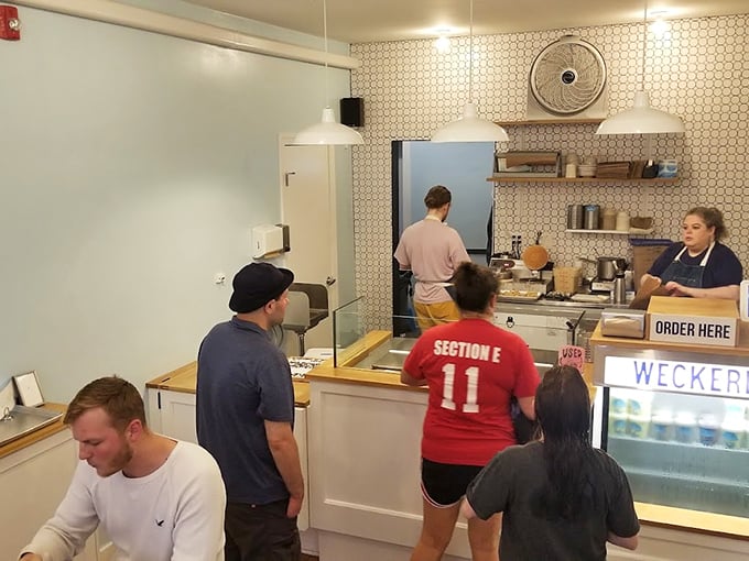 Ice cream pilgrims line up at the altar of frozen perfection. The minimalist interior lets the star attraction—those magnificent flavors—take center stage.