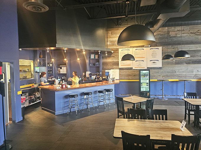 Modern industrial meets comfort food haven inside Preston's, where the blue walls and pendant lighting create the perfect backdrop for burger bliss.