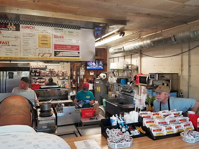Where burger magic happens. No fancy kitchen theatrics here—just decades of know-how and a well-seasoned flat-top grill creating Charlotte legends.